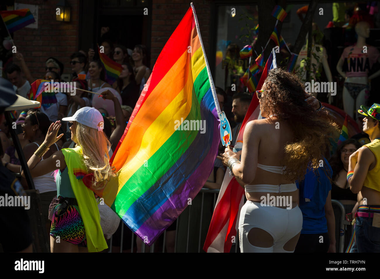 NEW YORK CITY - JUNE 25, 2017: Supporters wave rainbow flags as the ...