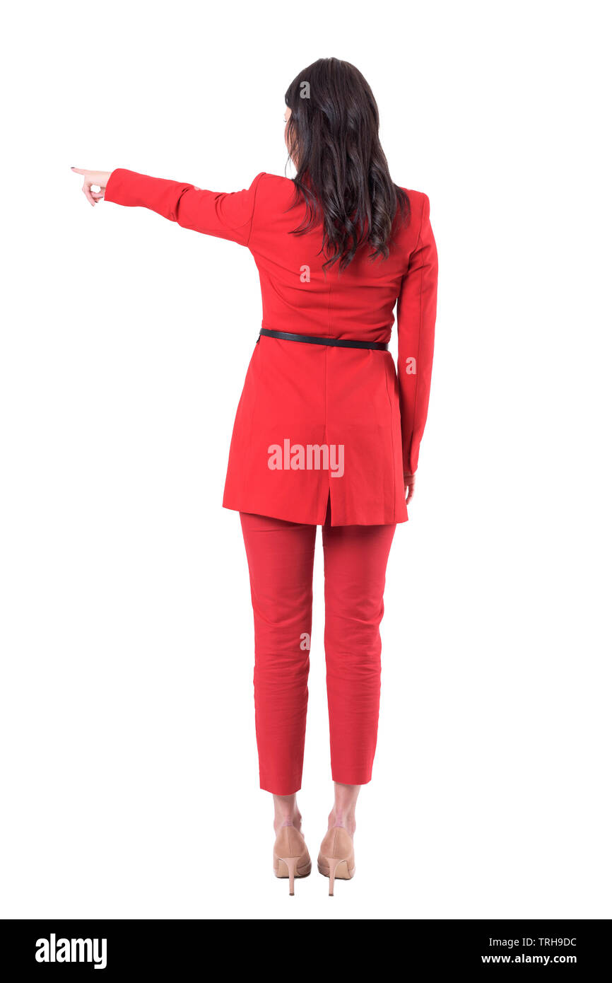 Back view of business woman leader in red suit pointing finger showing ...