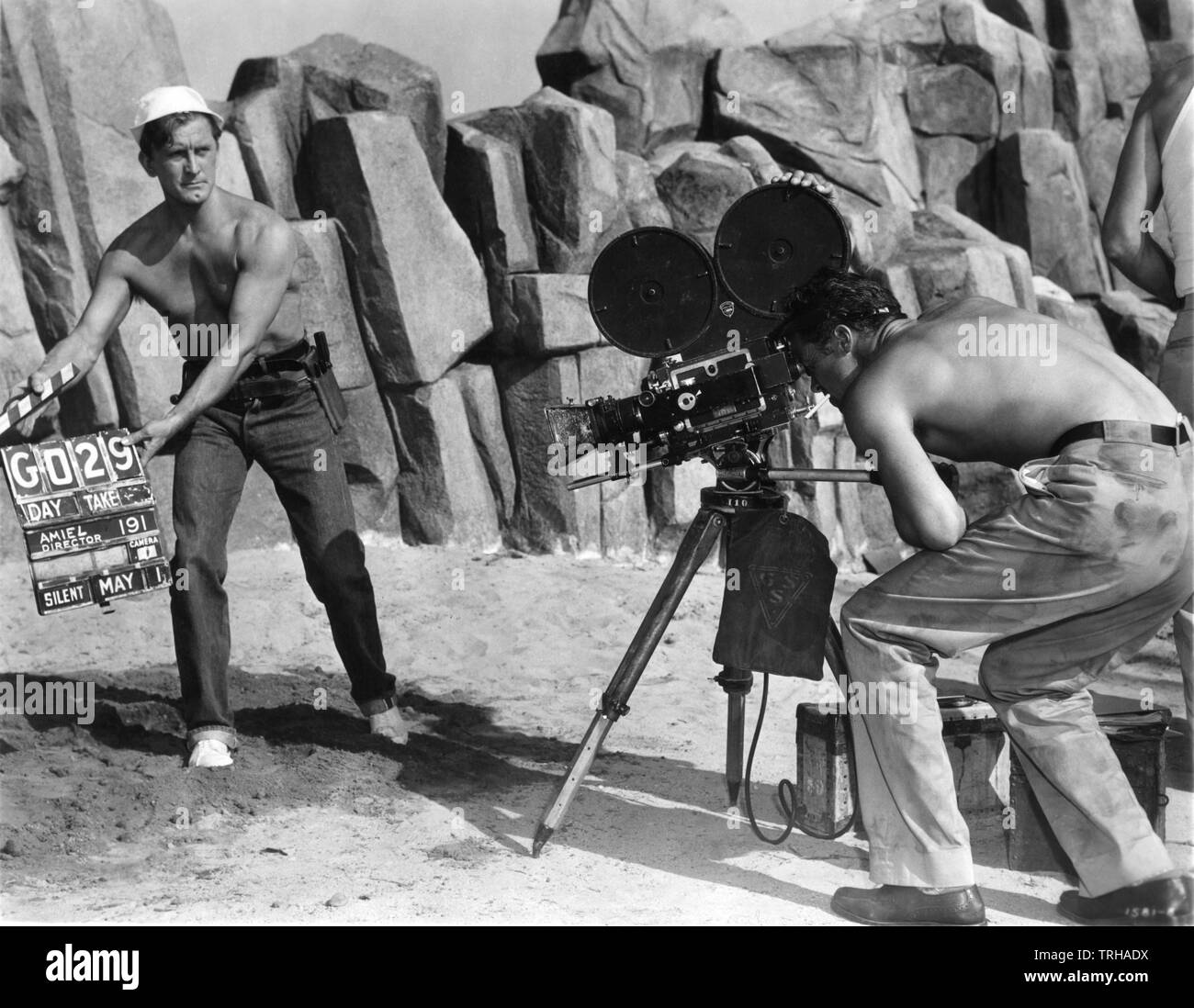KIRK DOUGLAS as movie producer Jonathan Shields holding clapperboard ...