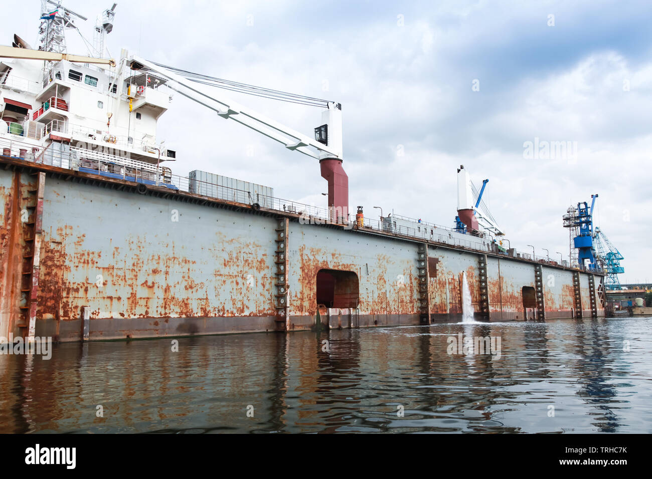 Old floating dry dock with ship under repair inside Stock Photo - Alamy