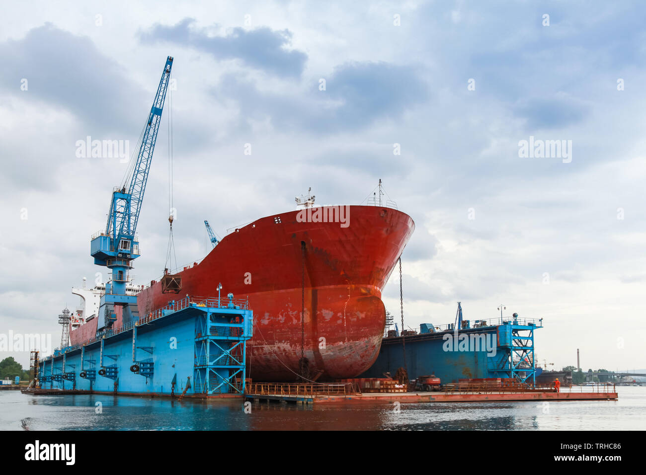 Huge red tanker is under repairing in blue dry dock, shipyard of Varna ...