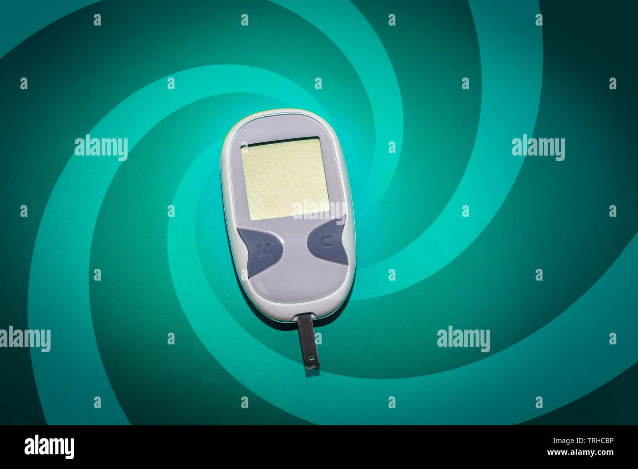 Blank glucometer on green spiral background. Diabetes concept Stock ...