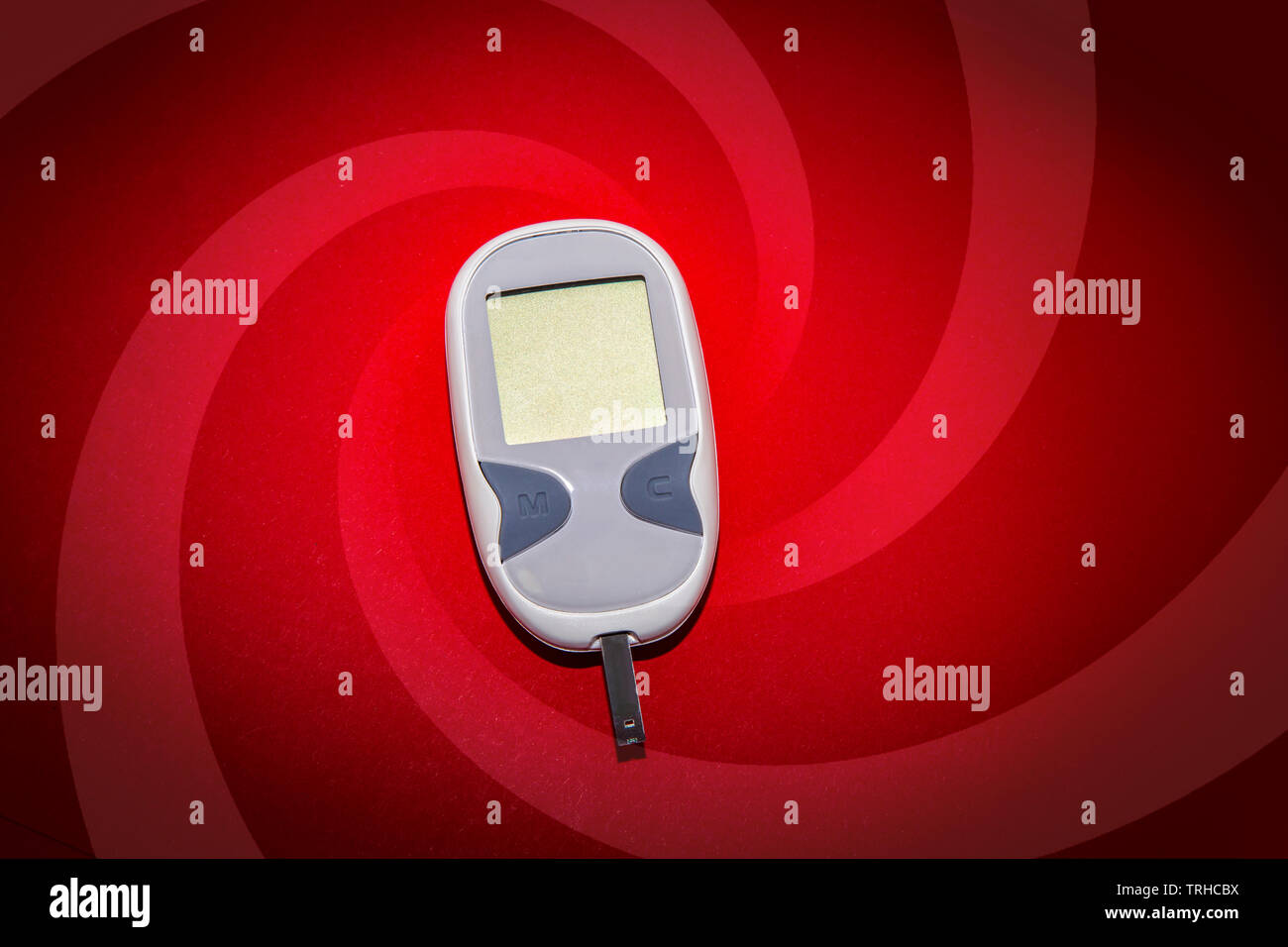 Blank glucometer on red background. Diabetes concept Stock Photo - Alamy