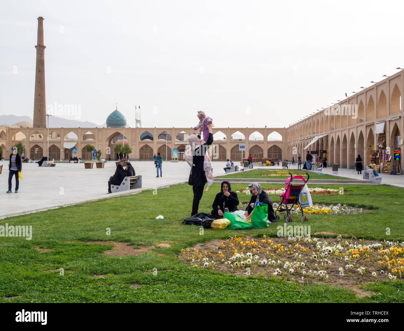 Picknickers relaxing at Maydan-e Imam Square, also known as Naqsh-e ...