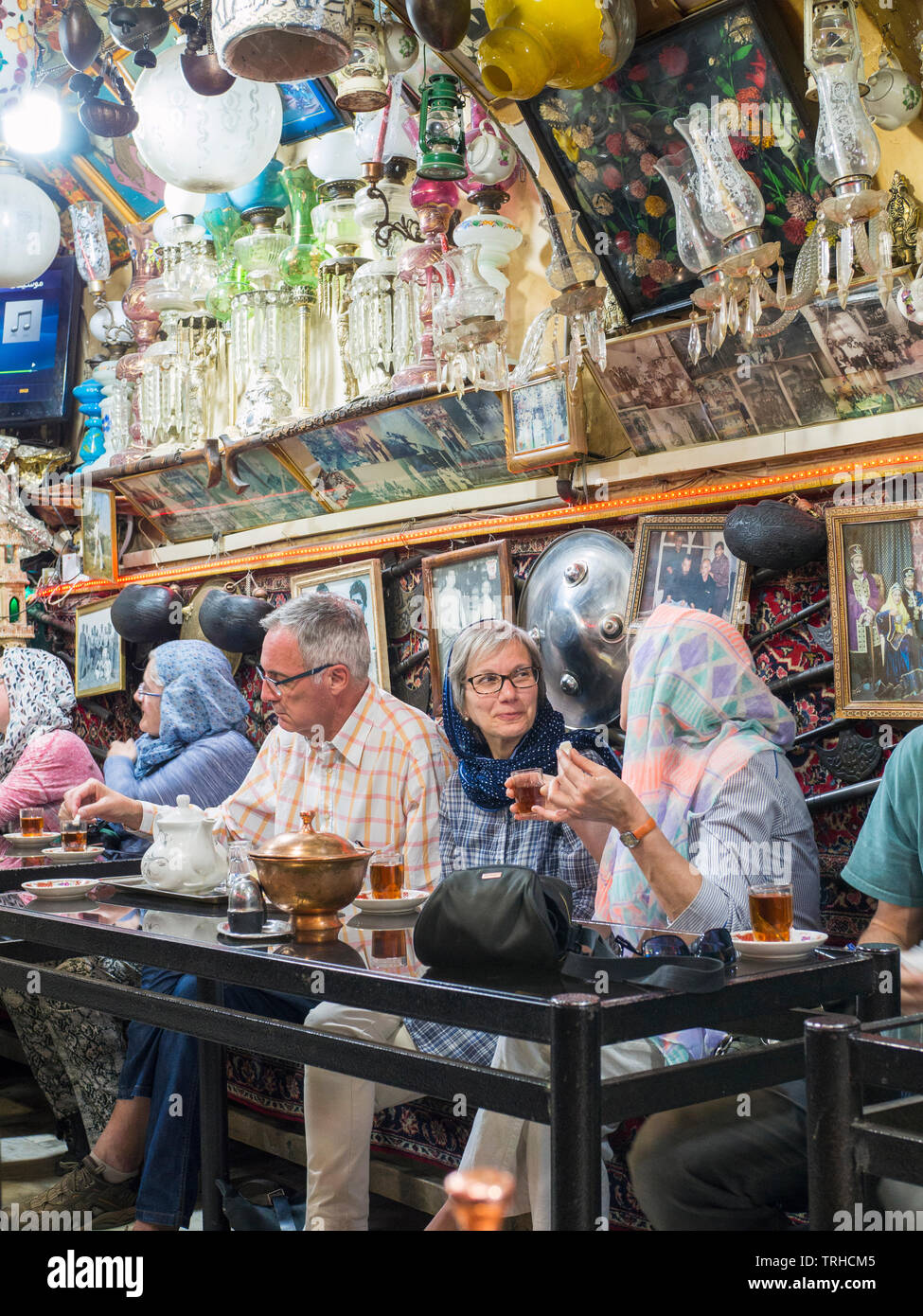 Tourists enjoying the Azadegan Cafe, a famous spot in Isfahan, Iran ...
