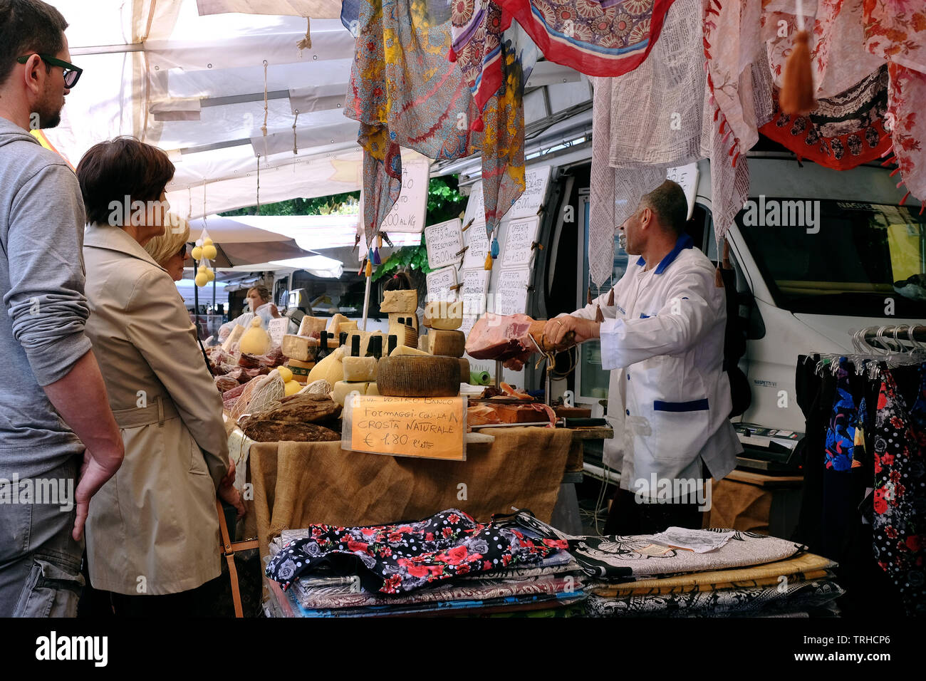 Meat and cheese merchants at the Saturday market in the coastal town of ...