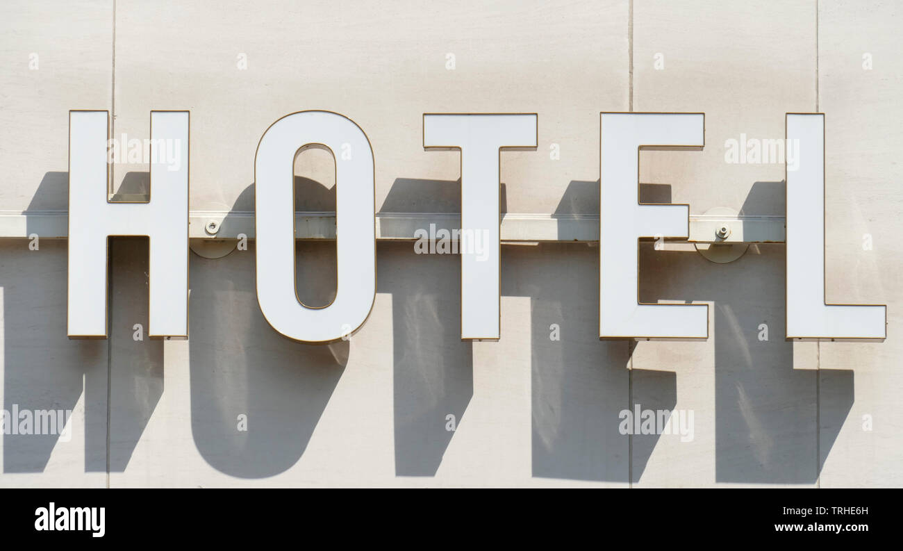 White hotel sign with shadow, Germany, Europe Stock Photo - Alamy