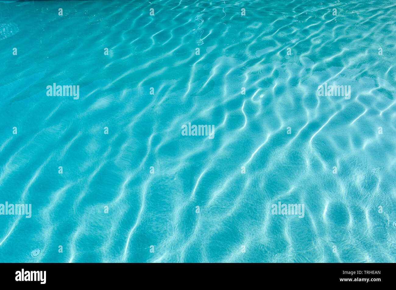 Surface of rippled blue swimming pool reflecting and shiny Stock Photo ...