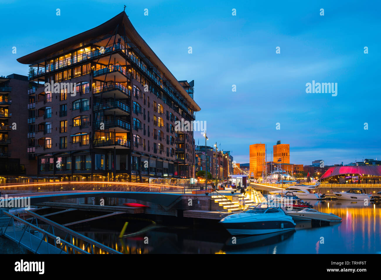 Oslo harbour, view at night of the harbour district (Aker Brygge) in ...