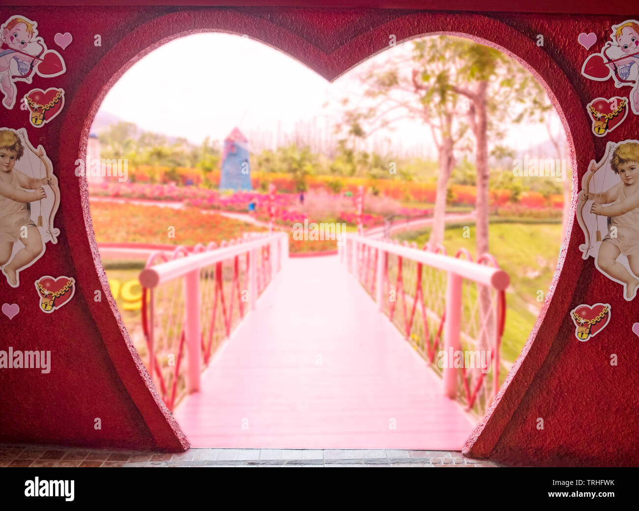 Gate heart shape link bridge in garden Stock Photo - Alamy