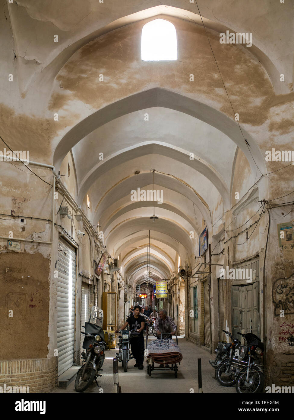 People walking in Yazd's desert bazaar, a historic tourist spot and ...