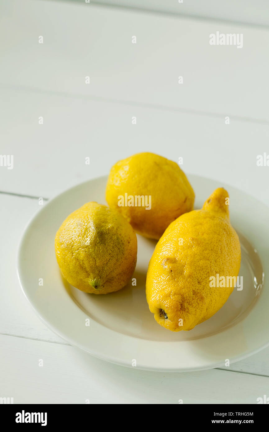 Trendy ugly organic three lemons unusual shape on white background ...
