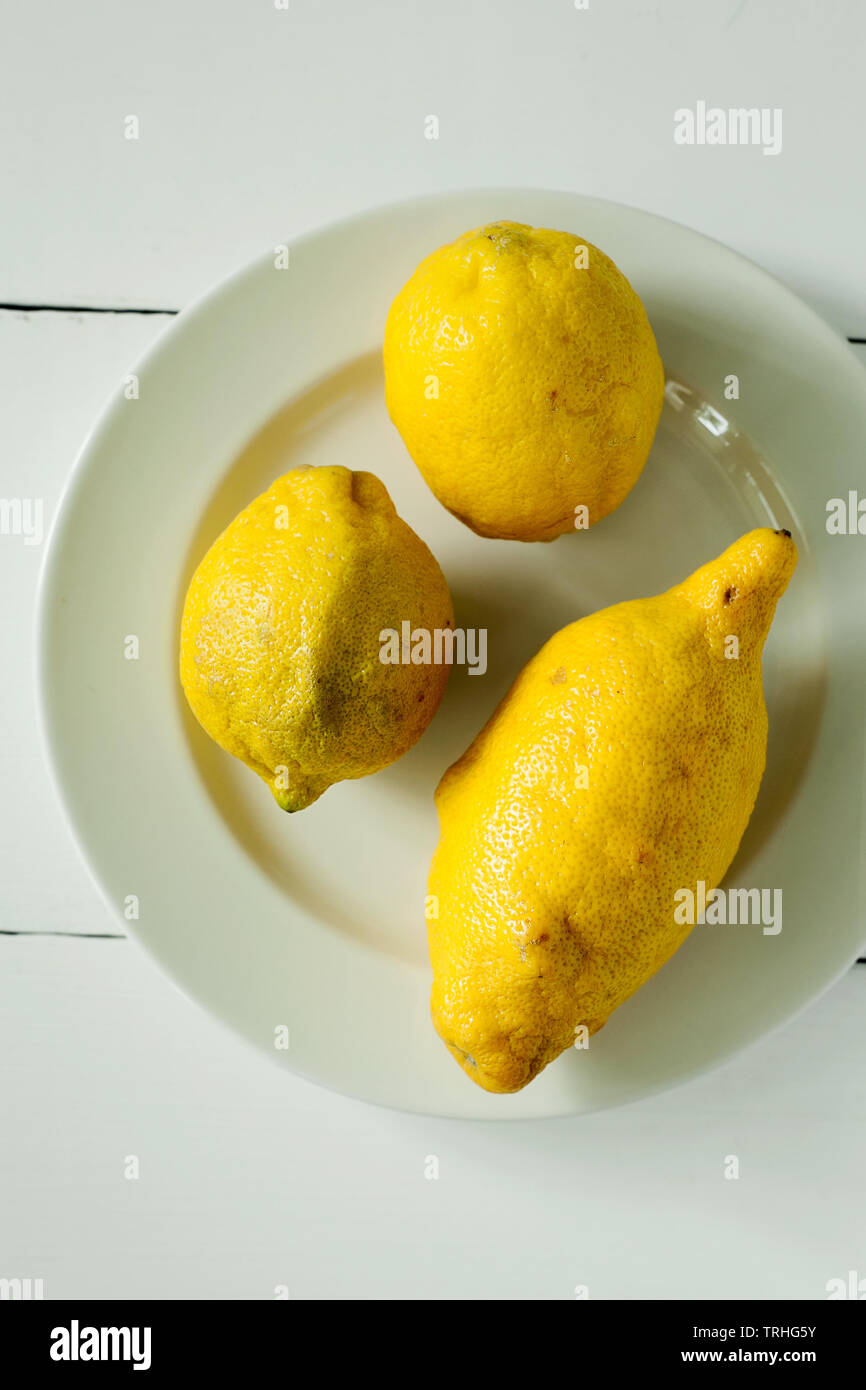 Trendy ugly organic three lemons unusual shape on white background ...