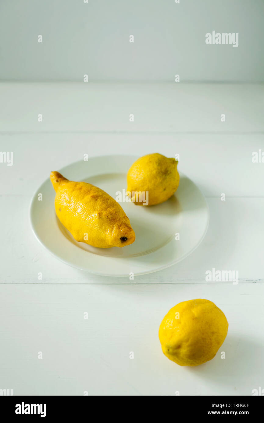 Trendy ugly organic three lemons unusual shape on white background ...