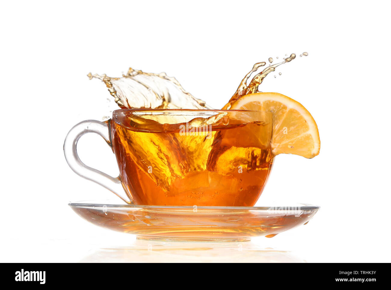 lemon tea with a splash on a white background Stock Photo - Alamy