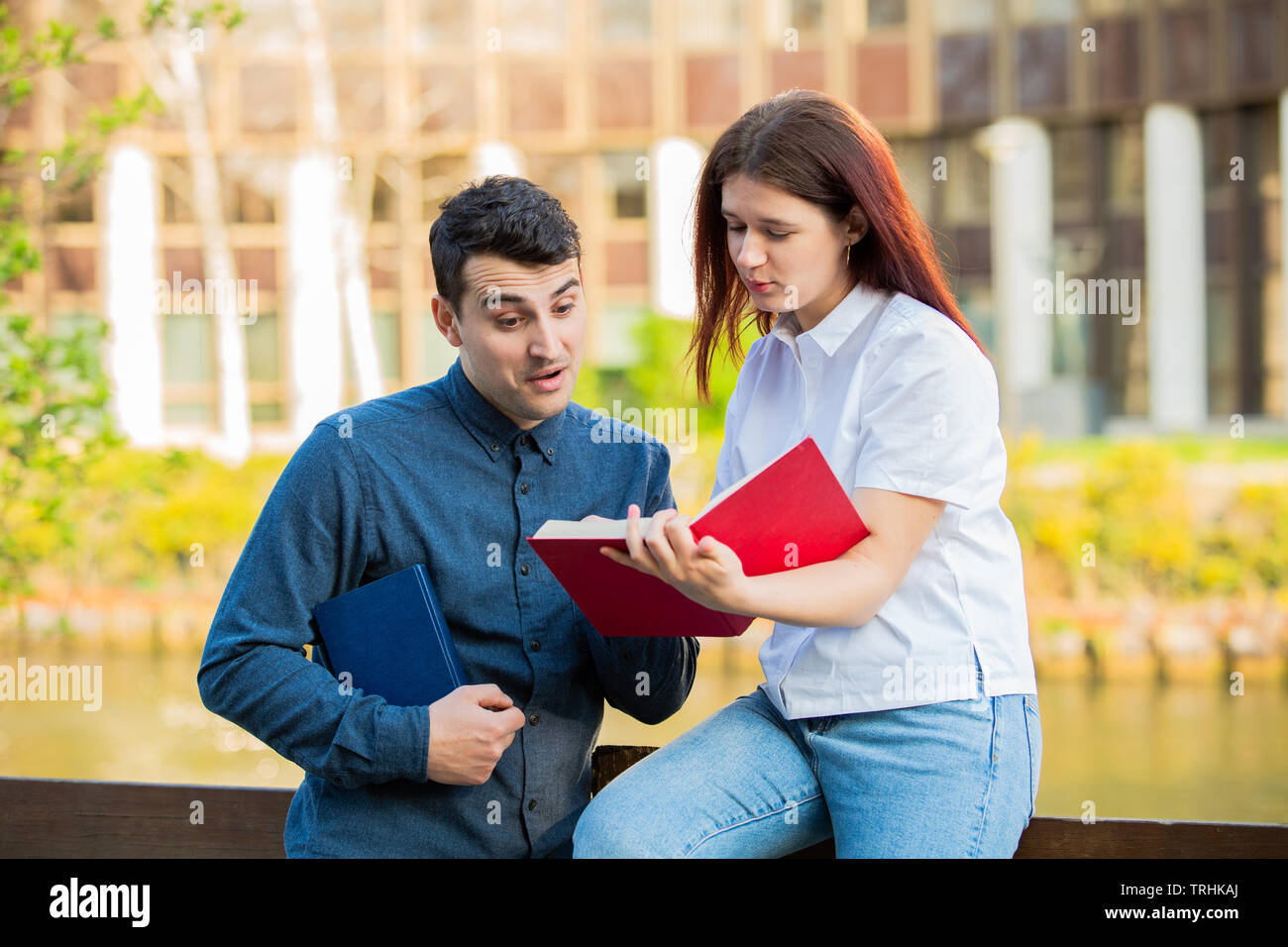 Students shoked by the right answer for exam together in a city park ...