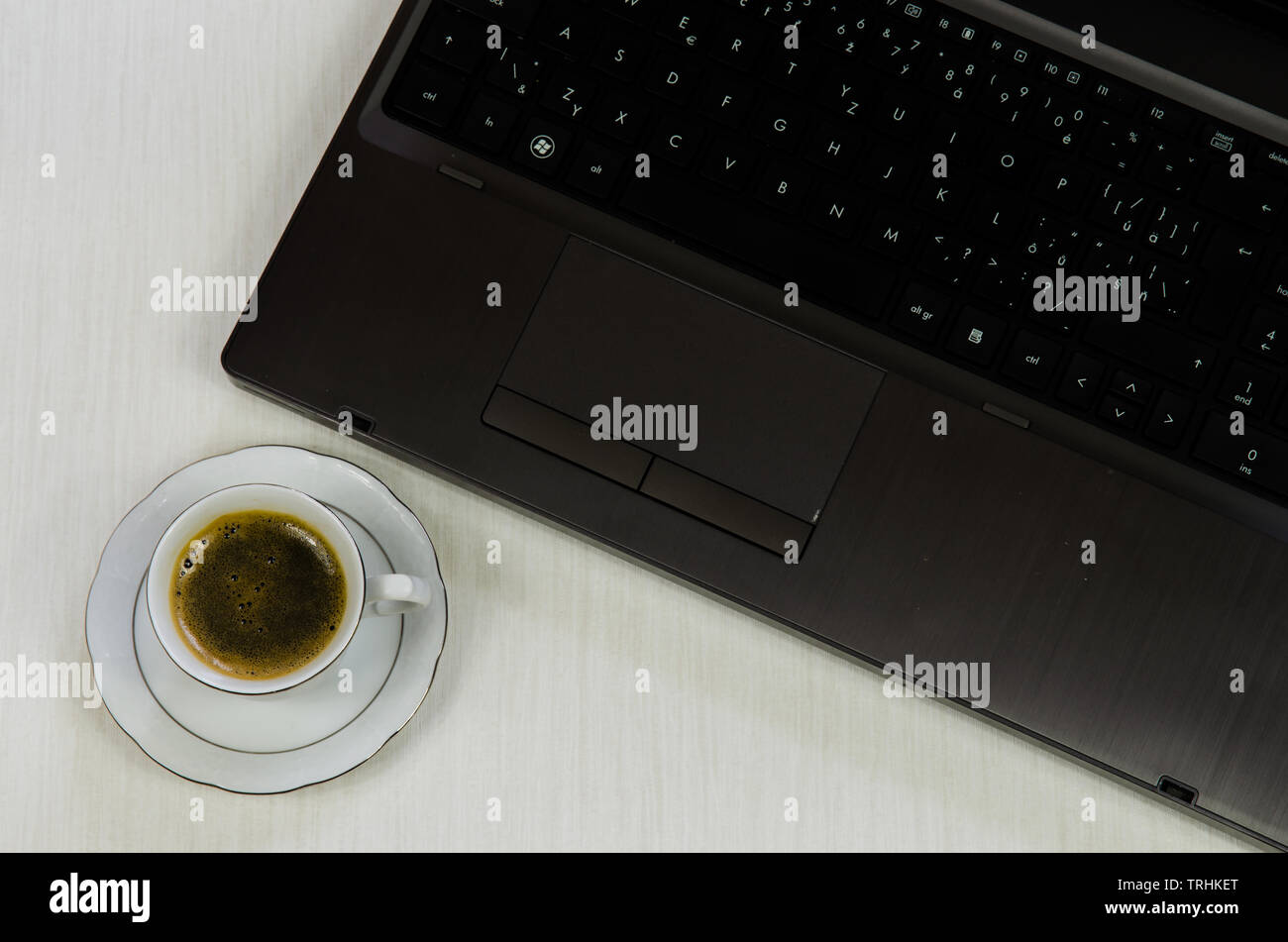 laptop and cup of coffee on the tablet Stock Photo - Alamy