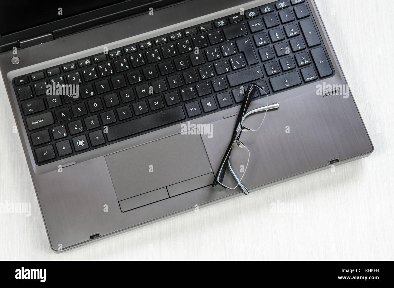 notebook keyboard and glasses isolated Stock Photo - Alamy