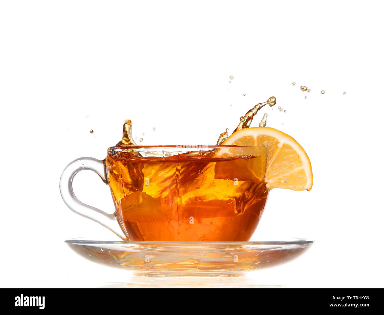 lemon tea with a splash on a white background Stock Photo - Alamy