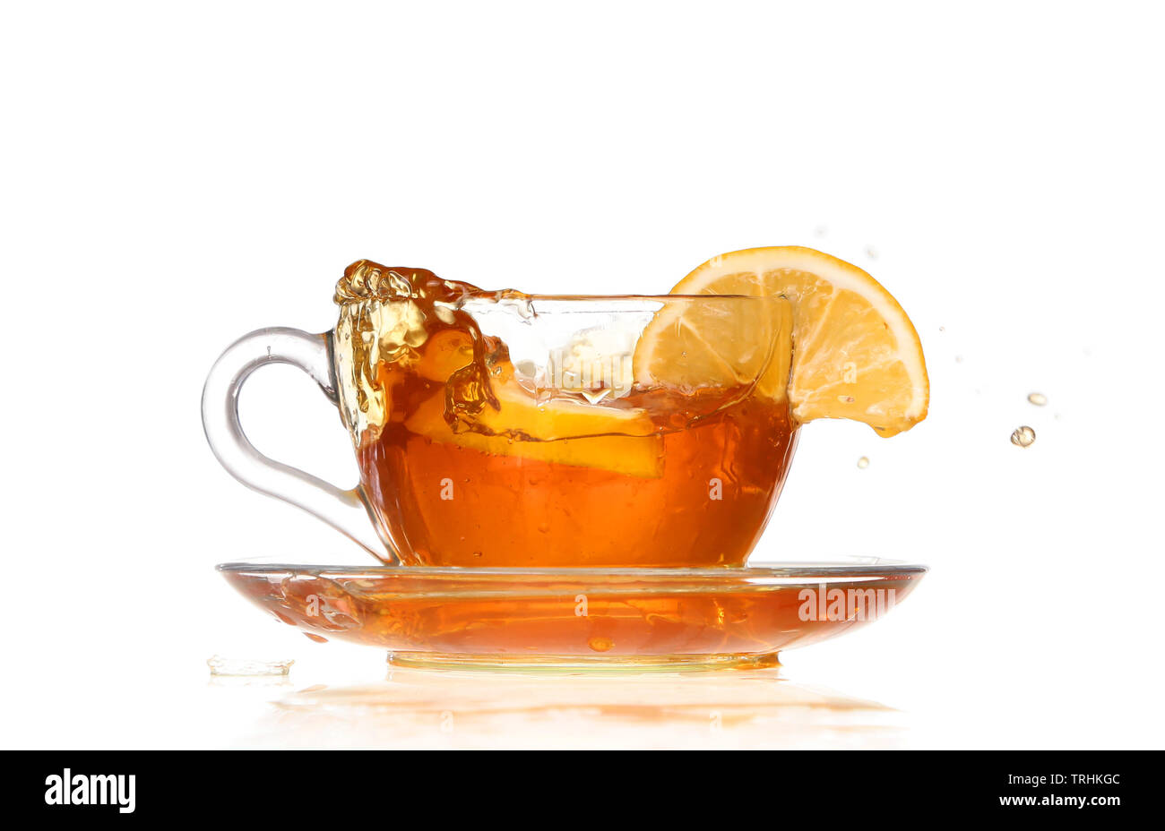 lemon tea with a splash on a white background Stock Photo - Alamy
