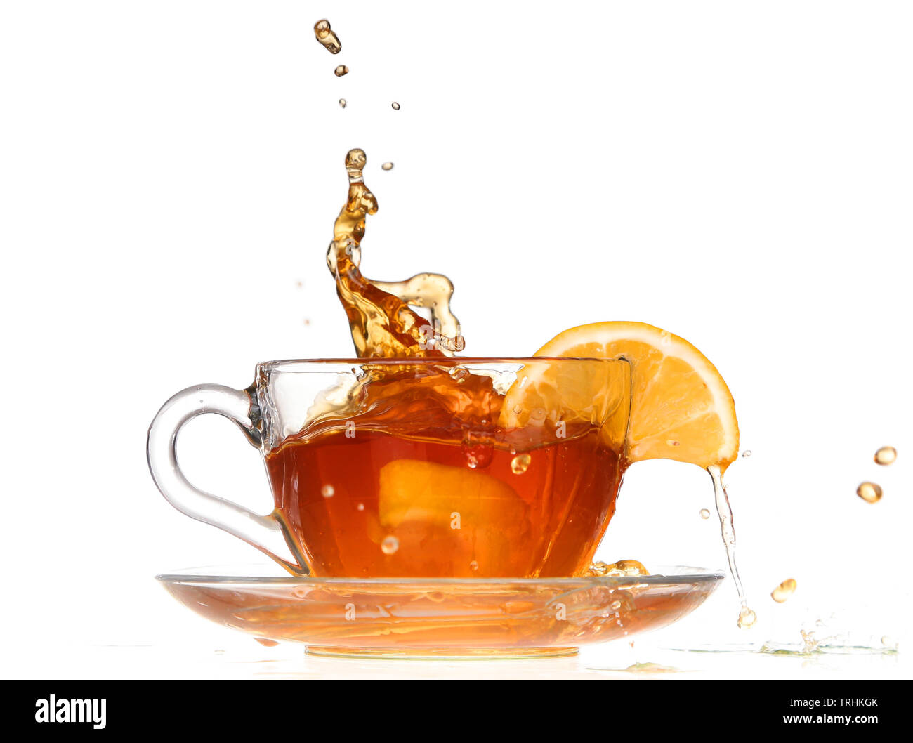lemon tea with a splash on a white background Stock Photo - Alamy