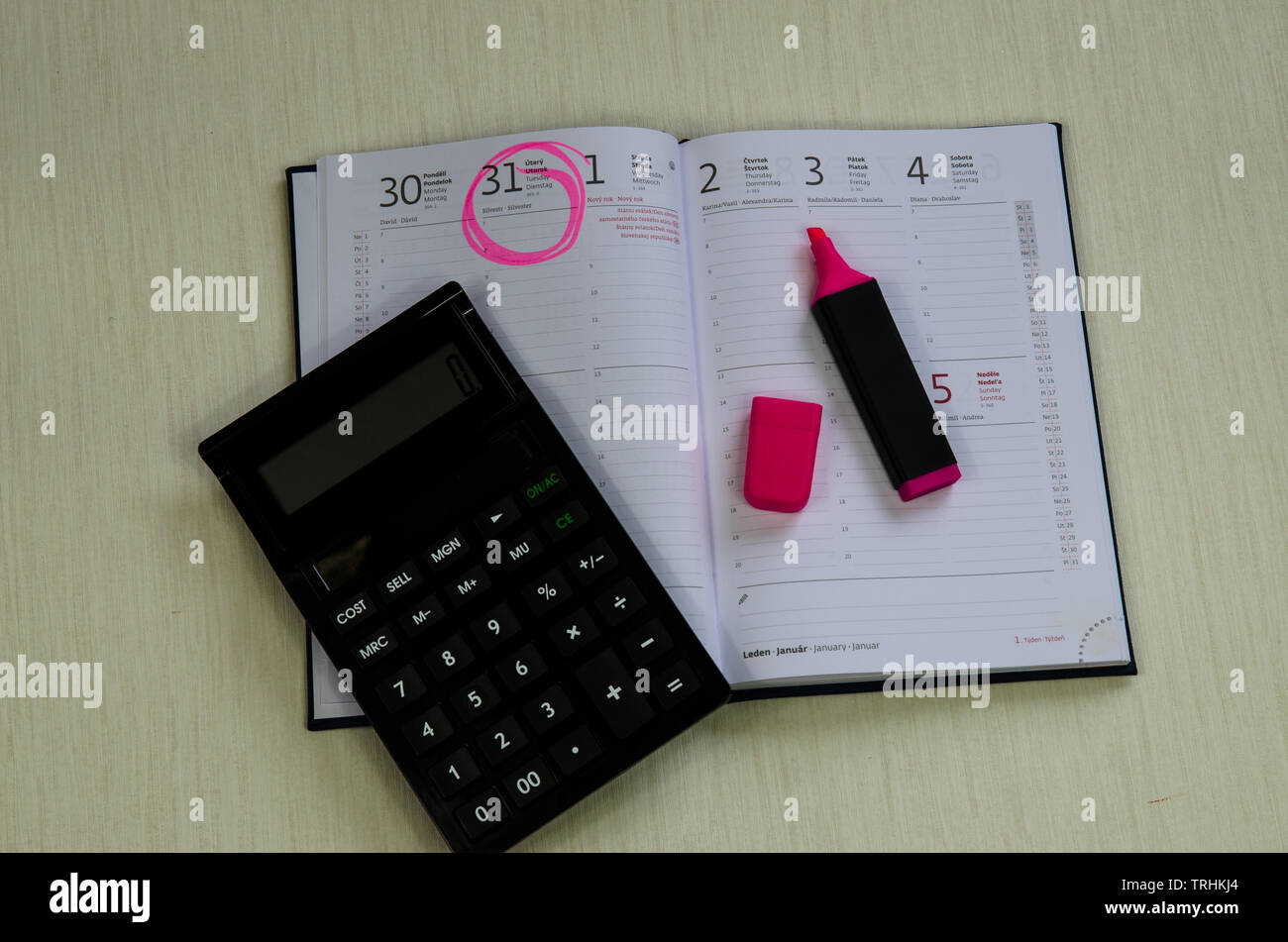 open calendar with marked date for deadline payment and red marker ...