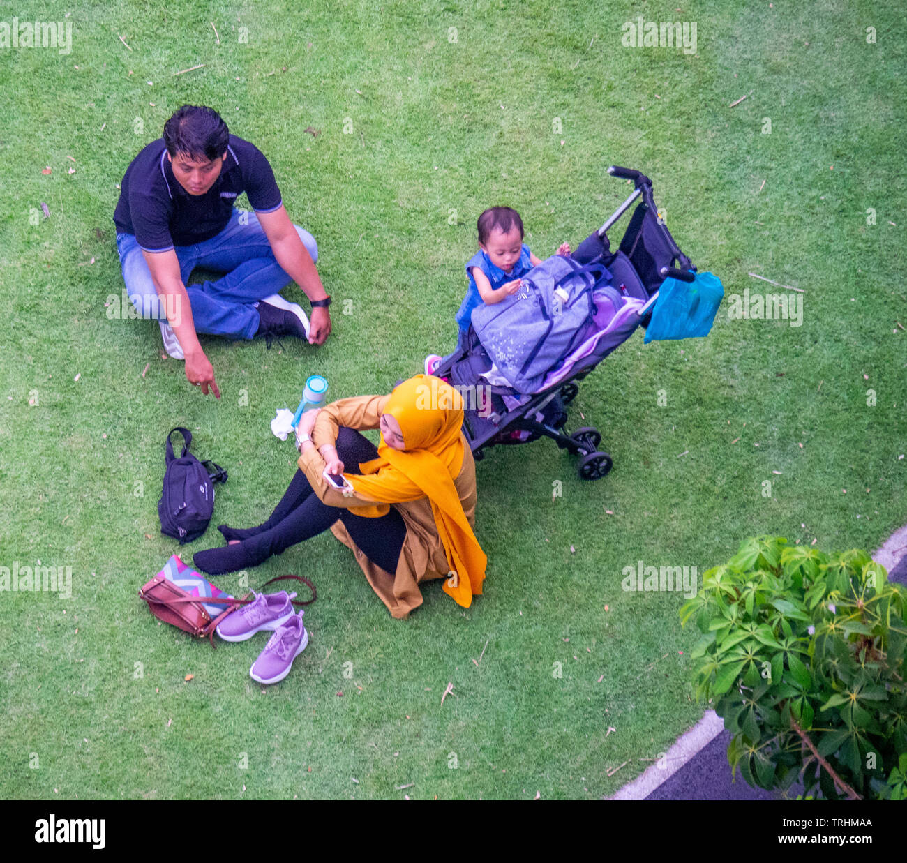 Young family and child with pram at Gardens by the Bay Singapore Stock ...