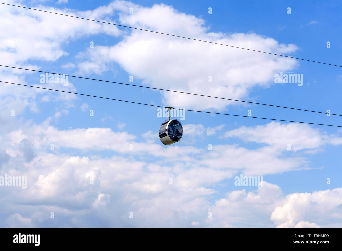 cable car on a background of blue sky with clouds Stock Photo - Alamy