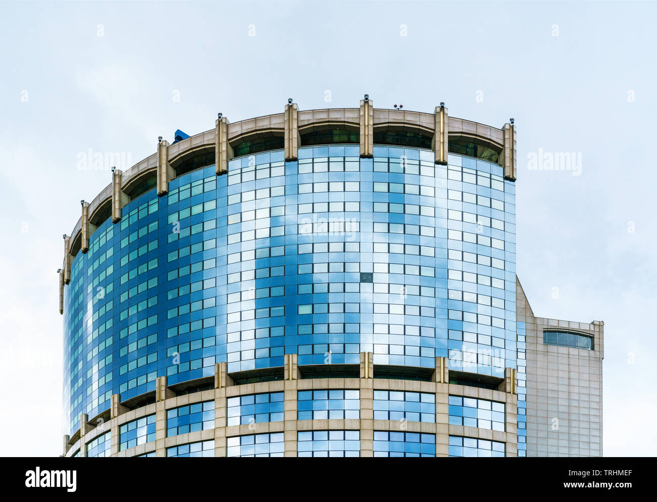 The upper part of the modern skyscraper Stock Photo - Alamy