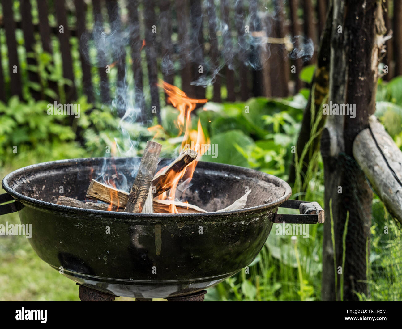 Barbecue grill with fire on nature, outdoor, close up. Empty Grill With ...