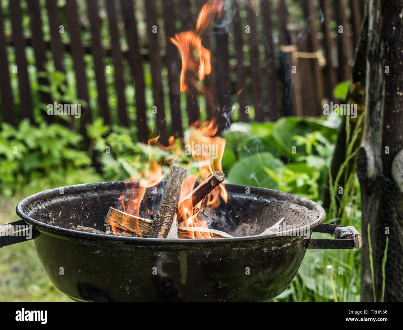 Barbecue grill with fire on nature, outdoor, close up. Empty Grill With ...