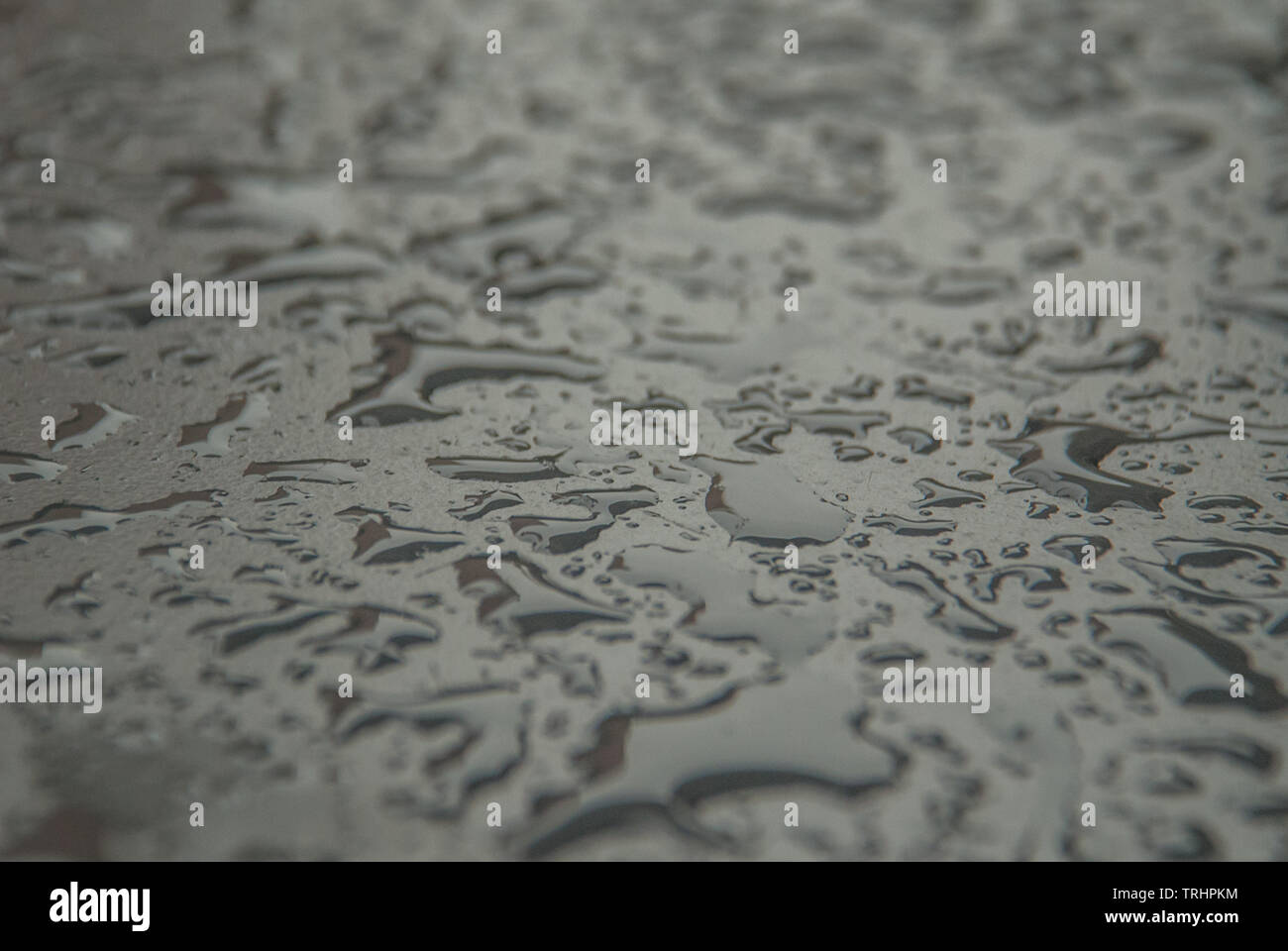 Close up raining water drop on the stainless steel, surface after rainy ...