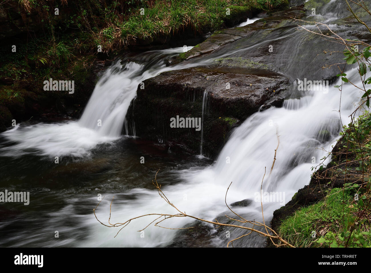 Long exposure of a waterfall at Watersmeet in Devon Stock Photo - Alamy
