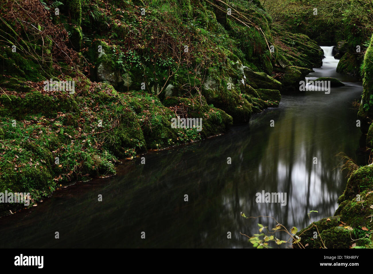 Long exposure of the river flowing through long pool at Watersmeet in ...
