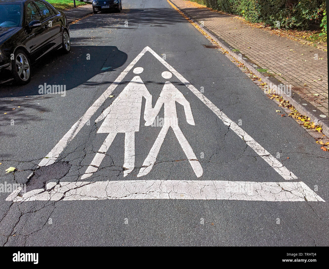 Holding hands crossing road hi-res stock photography and images - Alamy