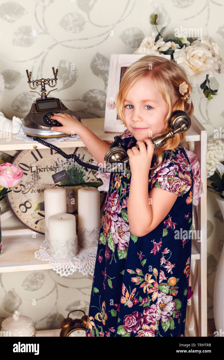 Cute little child girl with spring flowers, happy baby girl with basket ...