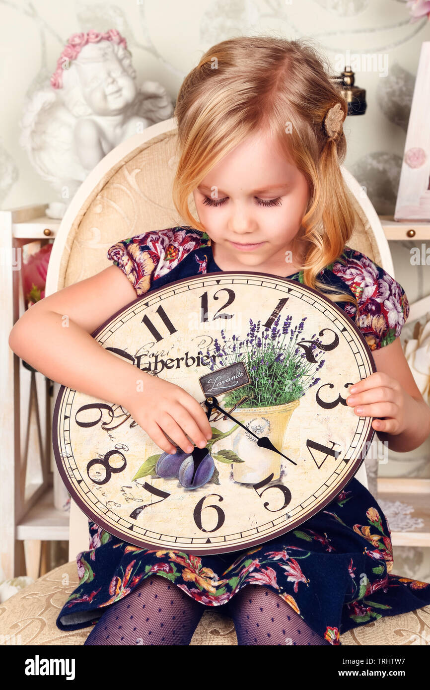 Cute little child girl with spring flowers, happy baby girl with basket ...