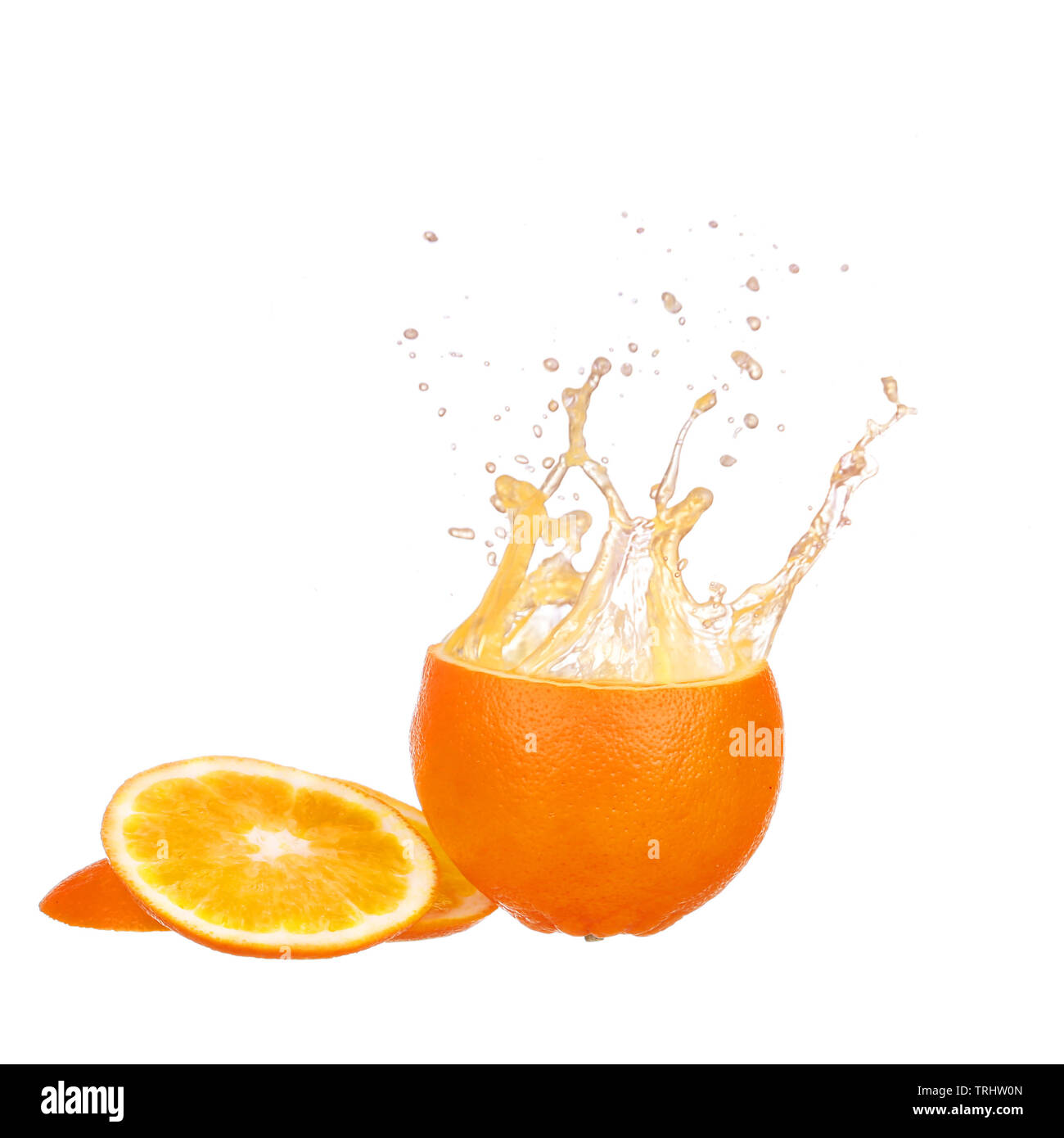 Orange juice splashing isolated on white Stock Photo - Alamy
