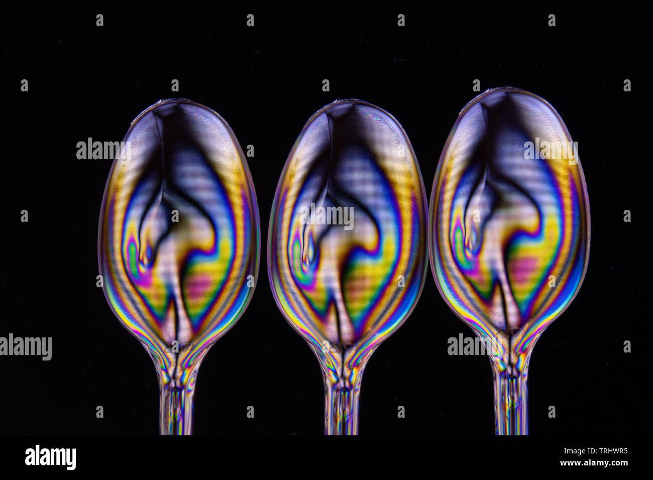 3 spoons in a row Stock Photo - Alamy