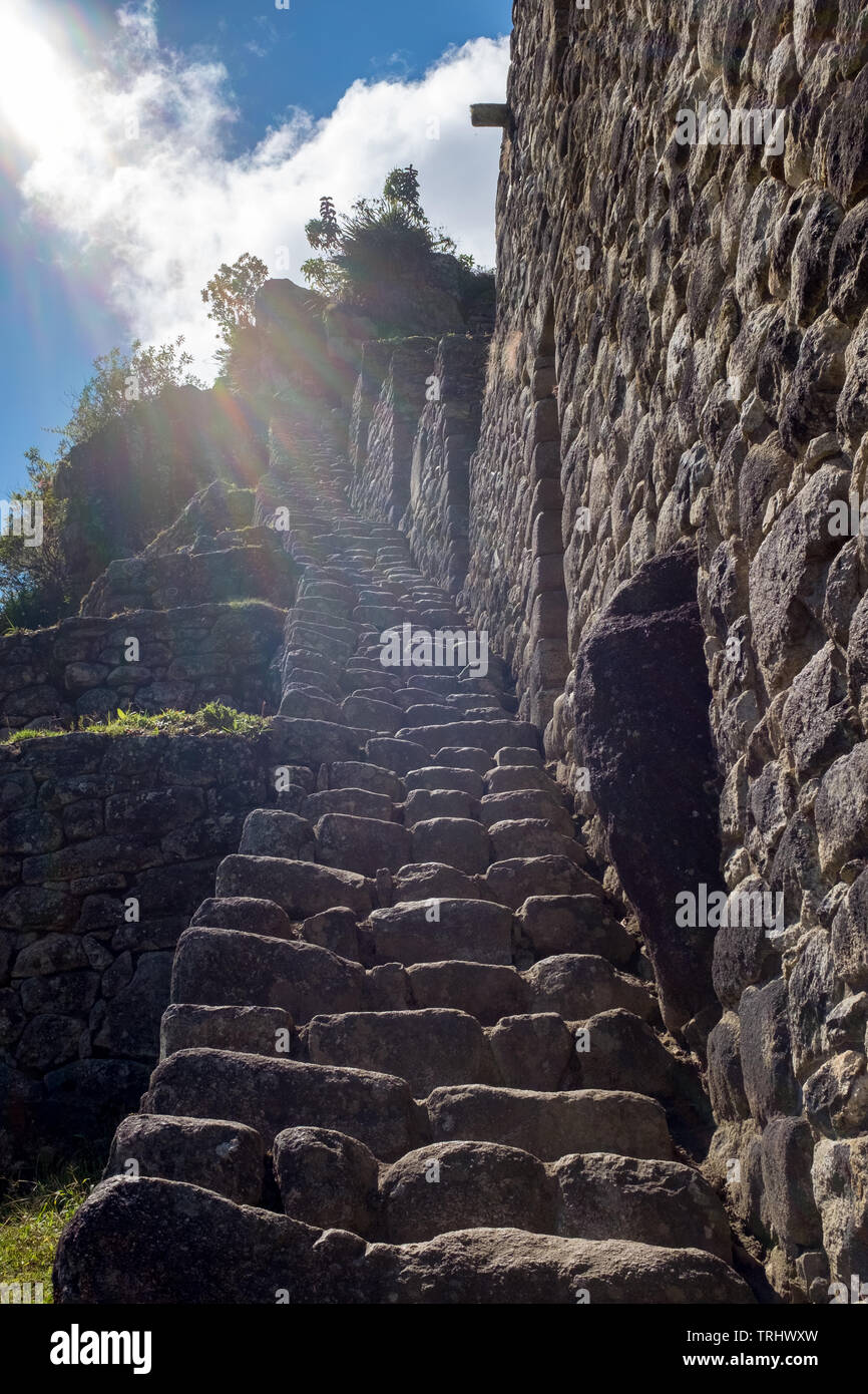 Narrow ancient steps lead up the side of one of the buildings at the ...