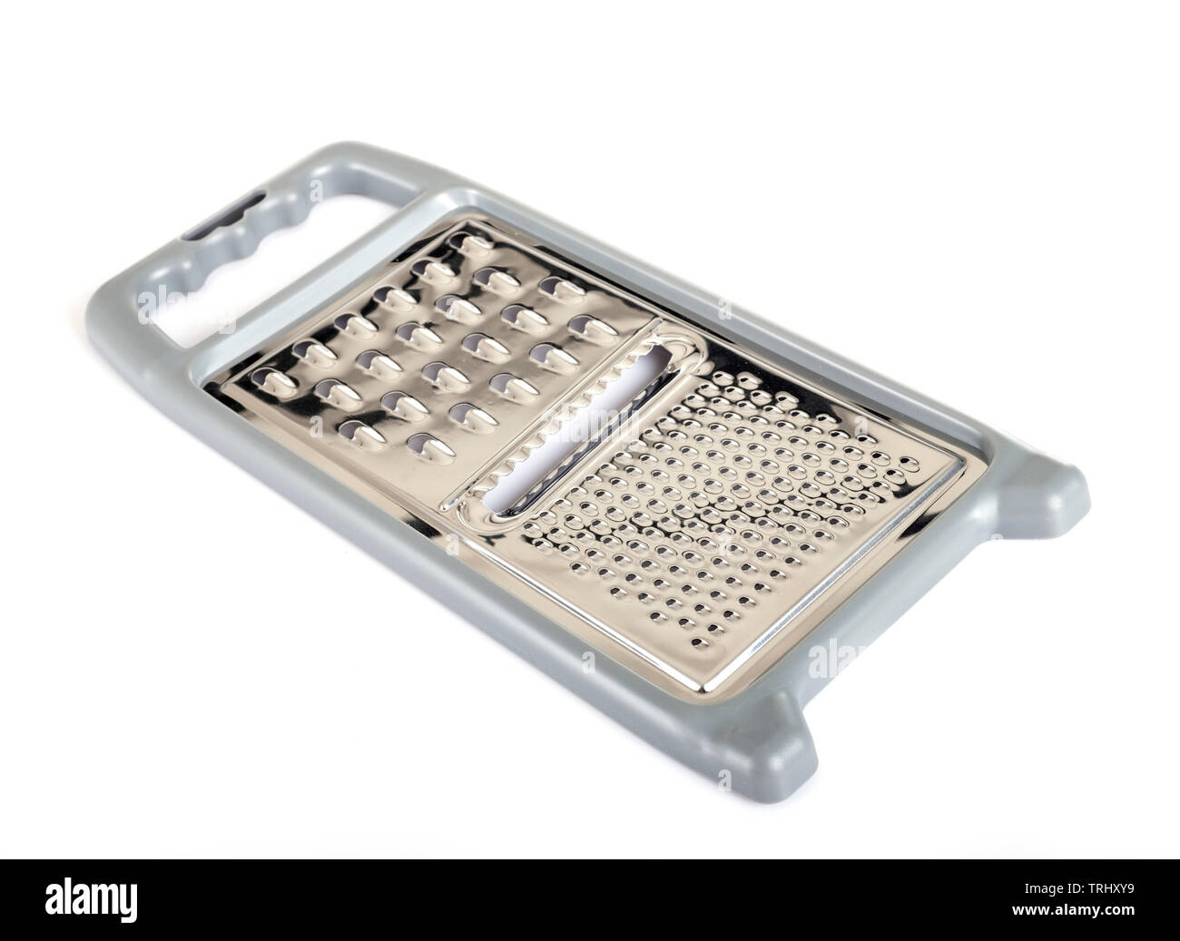 cheese grater in front of white background Stock Photo - Alamy