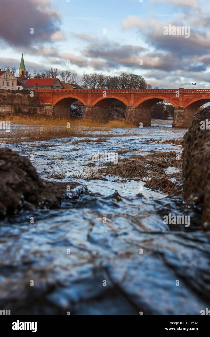 Kuldīga historical brick bridge viewed from Venta rapid Stock Photo - Alamy