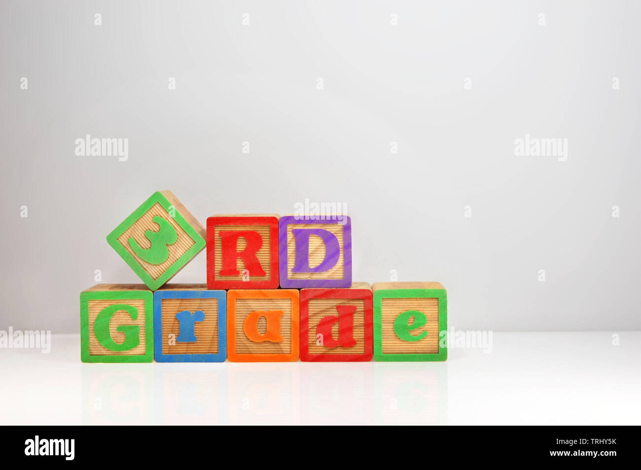 3rd Grade spelled out with ABC blocks Stock Photo - Alamy