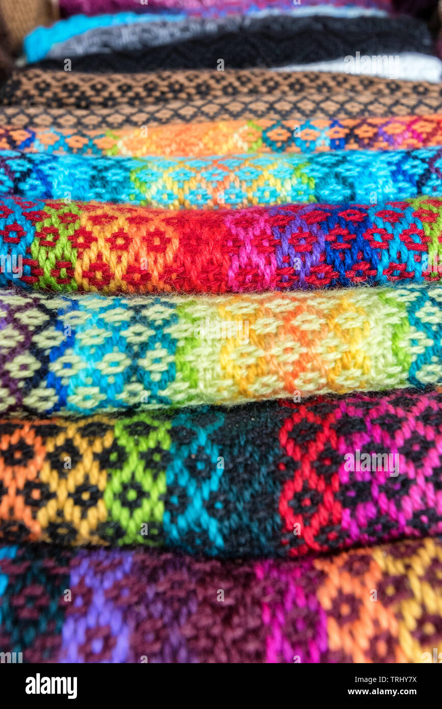 Traditional Quechuan and Peruvian textiles and balls of yarn Stock ...