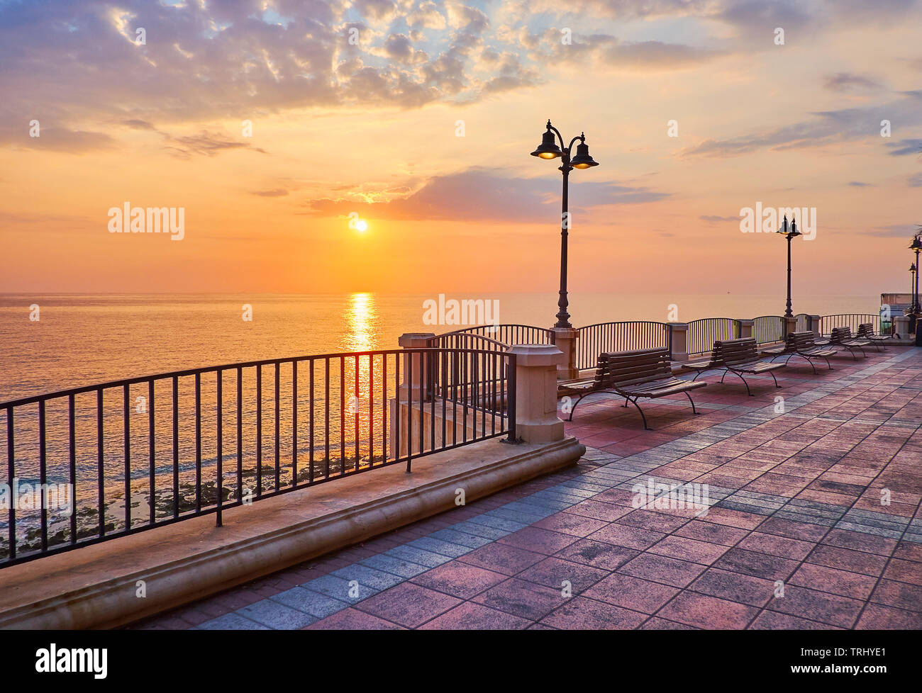 Enjoy the beautiful sunrise, walking along the seaside promenade of ...