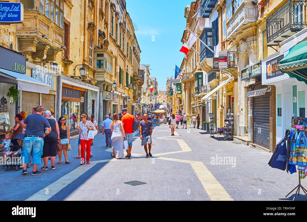 VALLETTA, MALTA - JUNE 19, 2018: The crowded Merchants street is one of ...