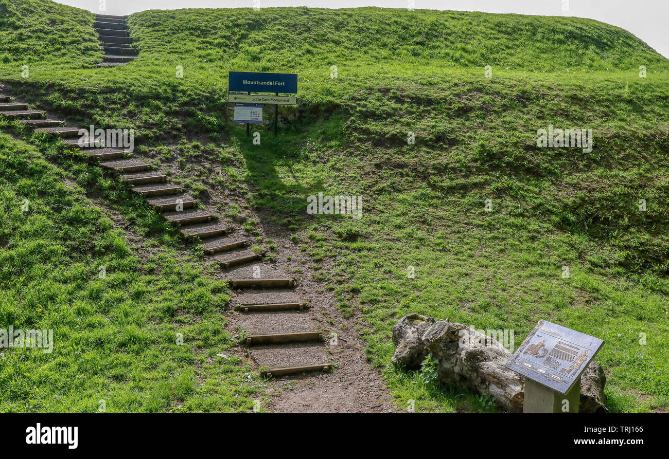 Information sign and steps up to the top of Mount Sandel Fort, a ...