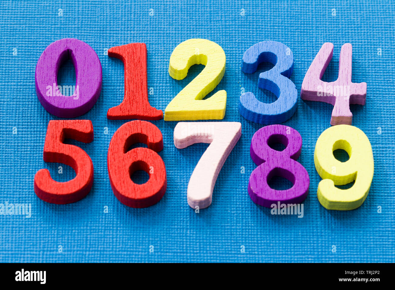 Many colorful numbers on blue background. easy mathemanics concept ...