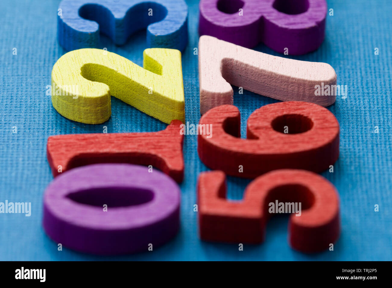 Many colorful numbers on blue background. easy mathemanics concept ...