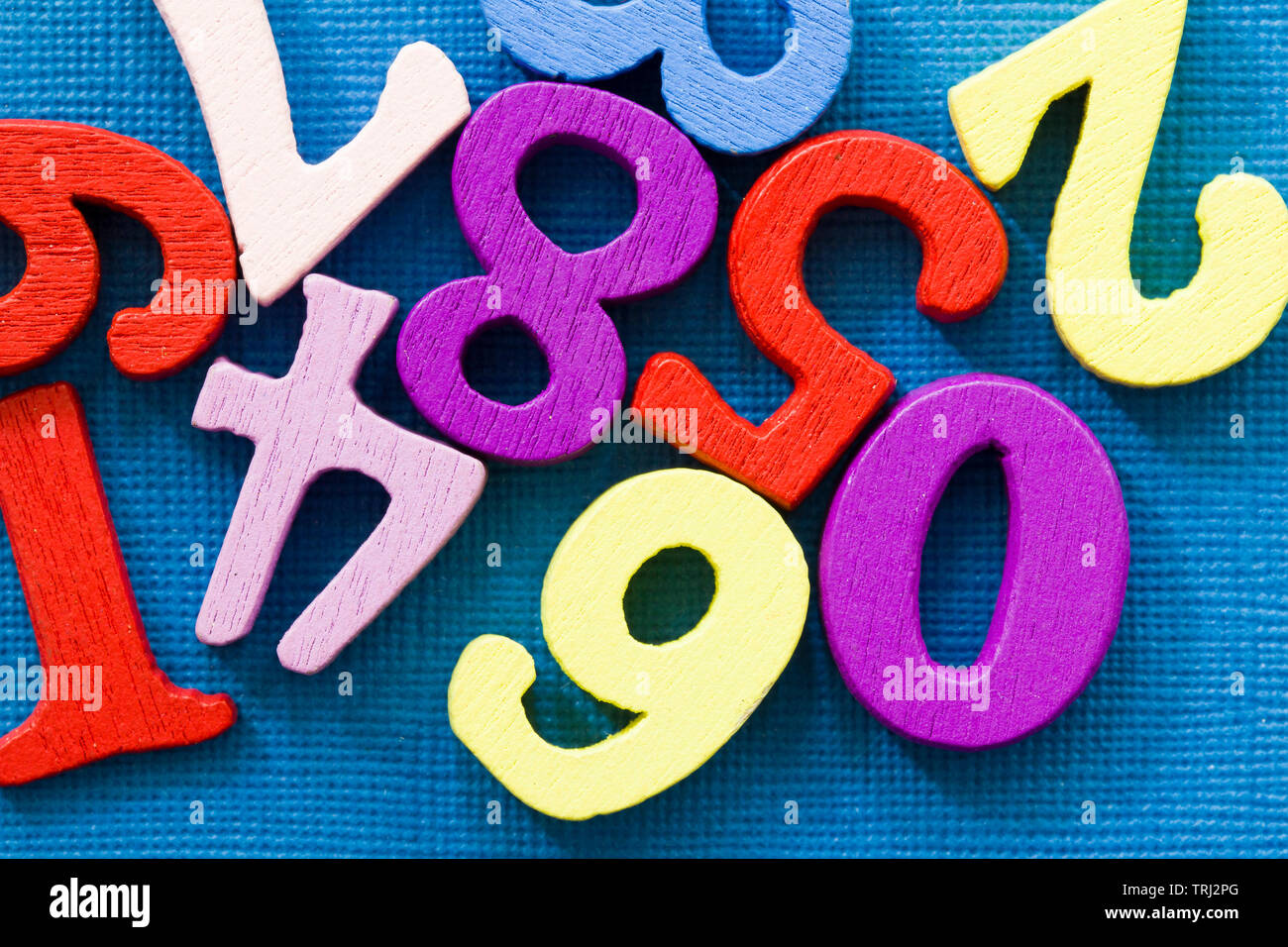 Many colorful numbers on blue background. easy mathemanics concept ...
